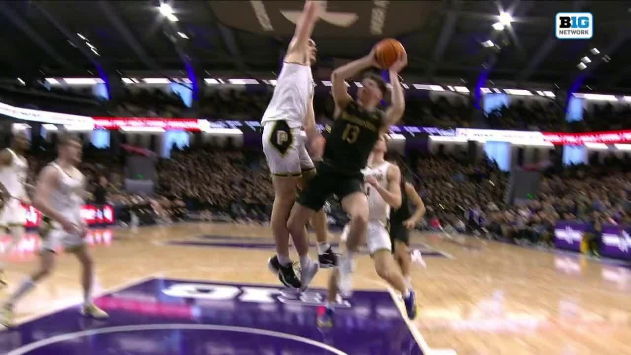 Zach Edey hangs in the air for his third block - ESPN Video