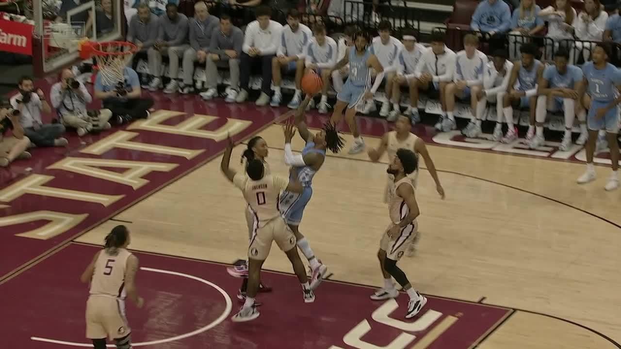 Caleb Love drives in for tough floater - ESPN Video