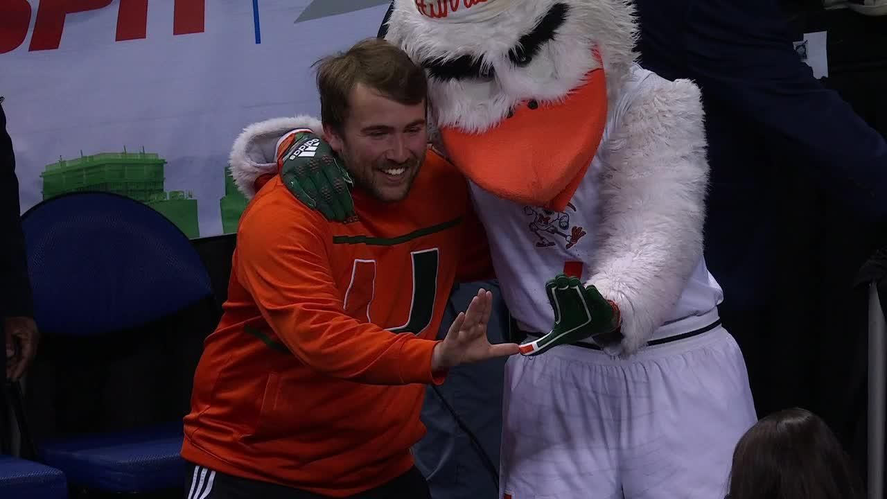 Miami fan makes half-court shot - ESPN Video