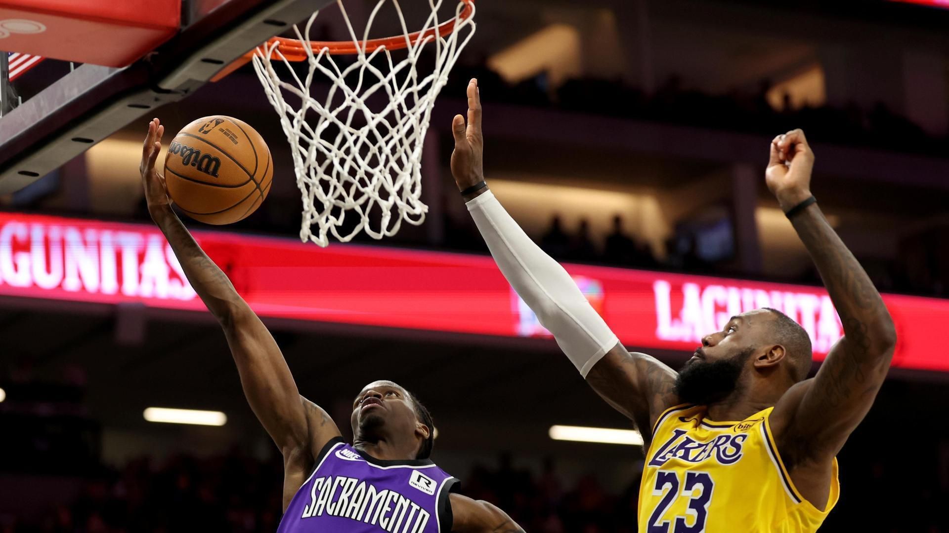 LeBron pins block off glass, scores on other end - ESPN Video
