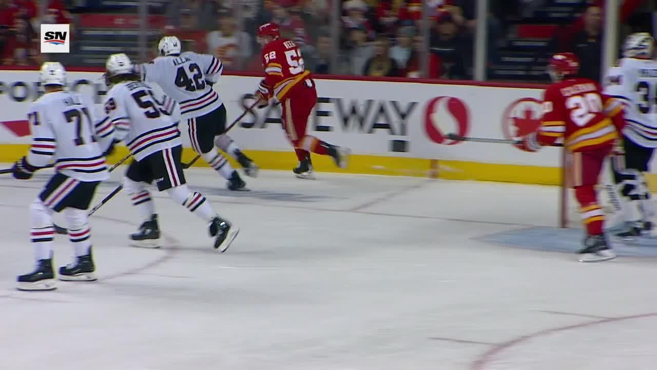 Flames get goals from 6 players in a 6-4 victory over the Blackhawks - ESPN