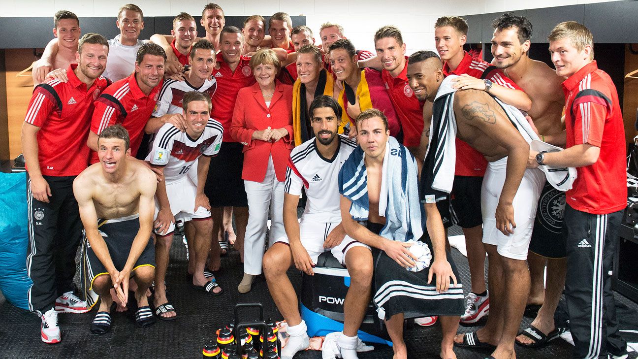 Angela Merkel poses with Germany squad after Portugal victory - ESPN
