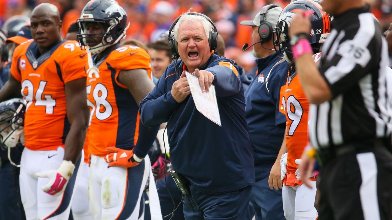 Broncos defensive coordinator Wade Phillips gets decked on the sideline ...