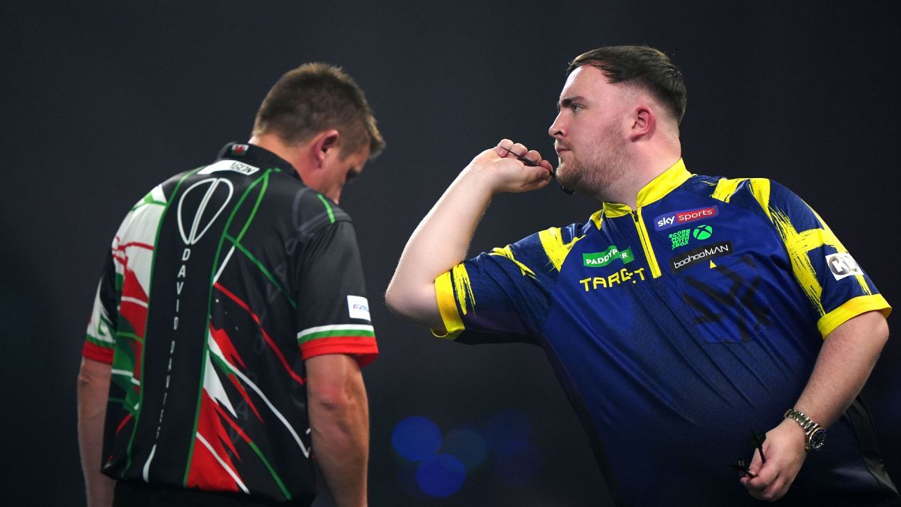 World Darts Championship: Luke Littler beats David Davies, eases into ...